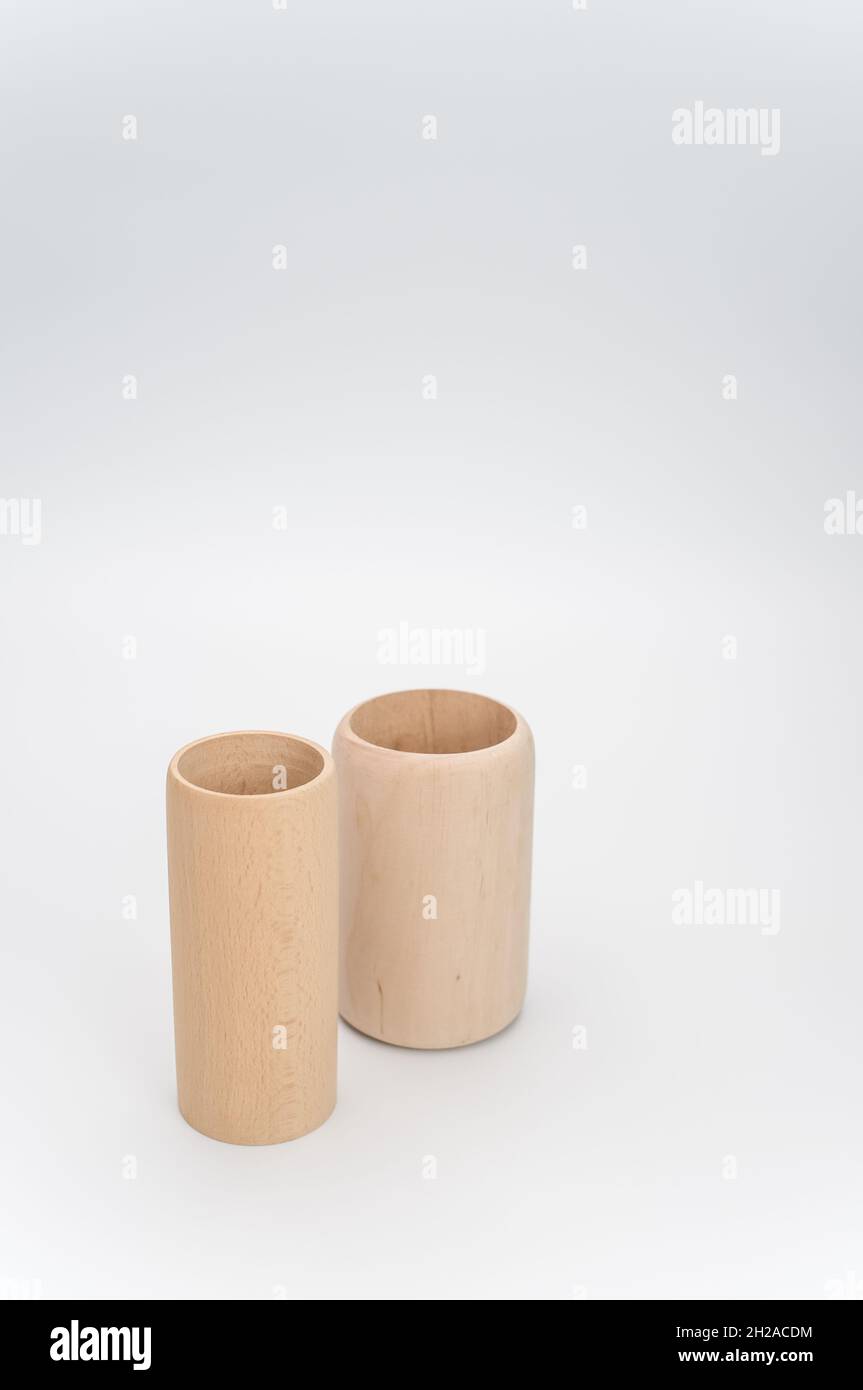 two wooden empty pen holder on a white background Stock Photo - Alamy