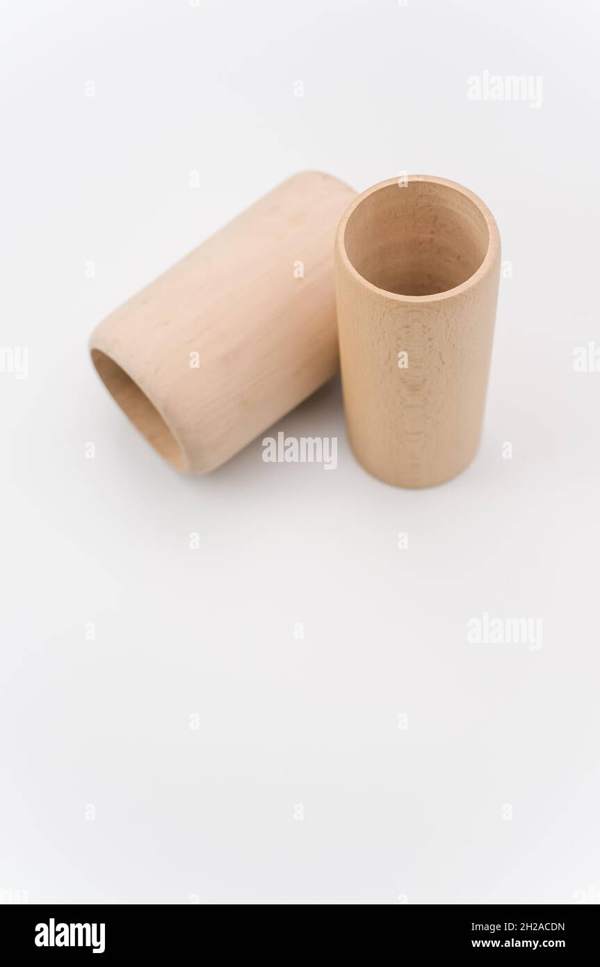 two wooden empty pen holder on a white background Stock Photo - Alamy