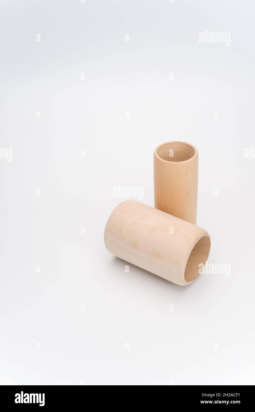 two wooden empty pen holder on a white background Stock Photo - Alamy