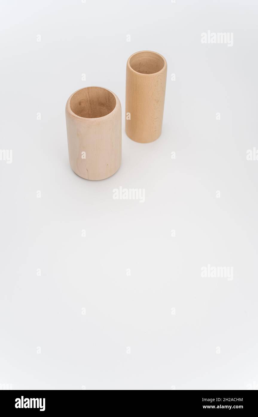 two wooden empty pen holder on a white background Stock Photo - Alamy