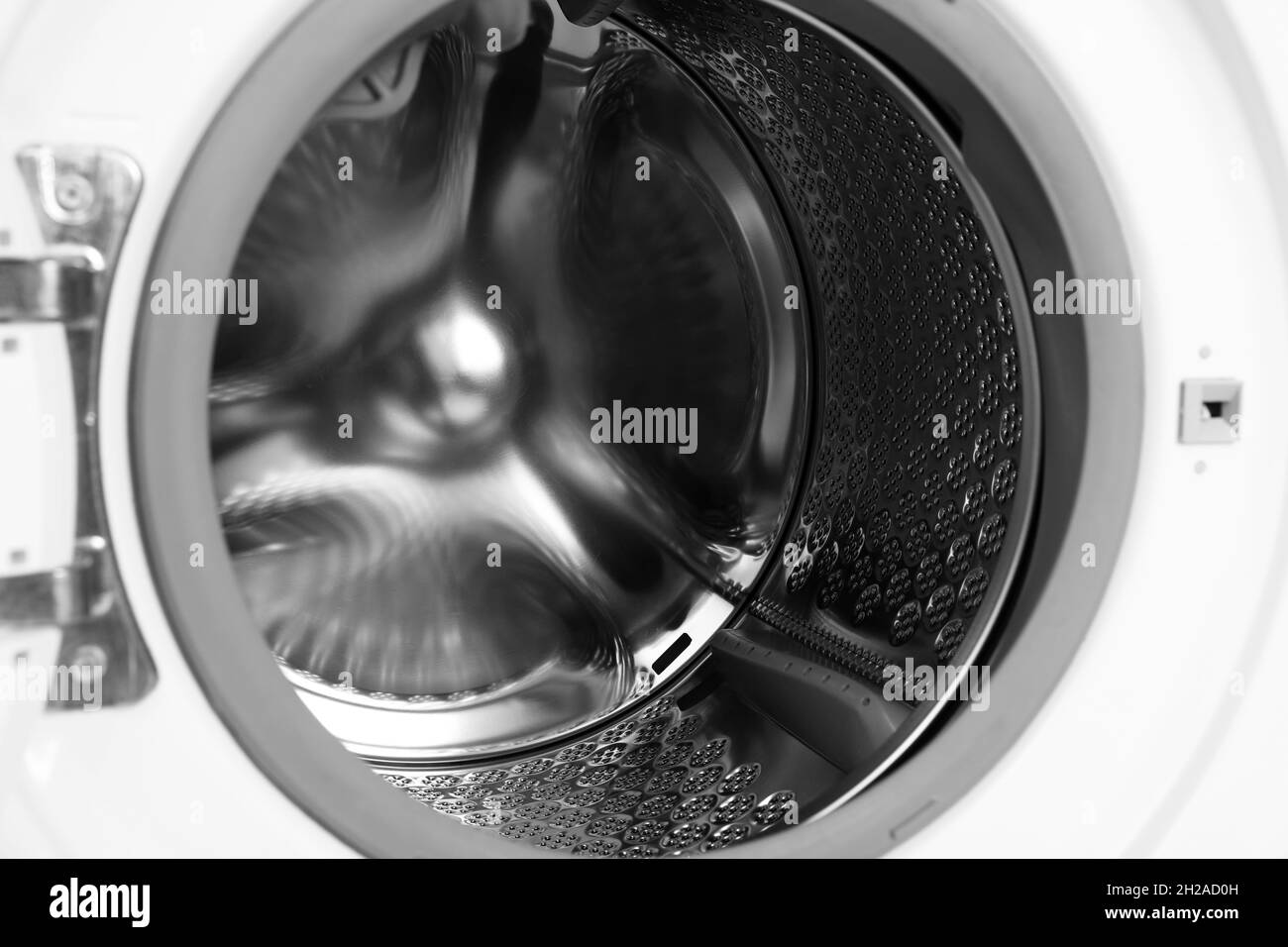 Empty washing machine drum, closeup. Laundry day Stock Photo - Alamy