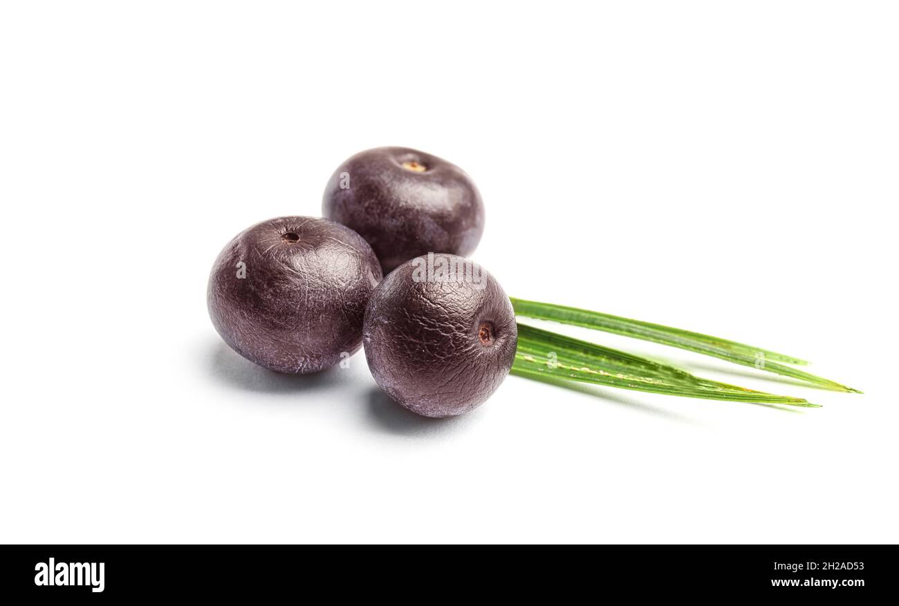 Fresh acai berries with leaves on white background Stock Photo - Alamy