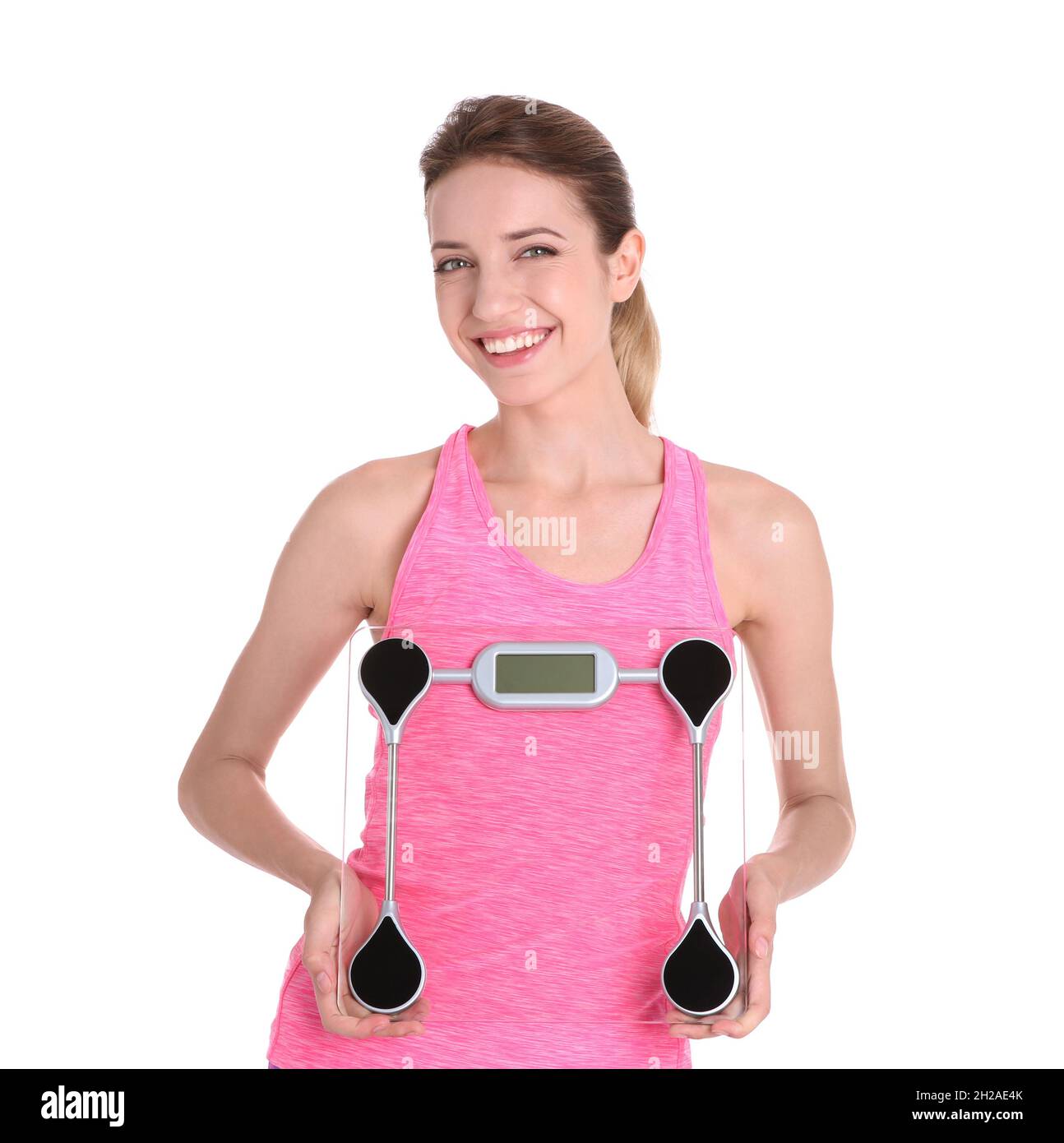 Young beautiful woman with scales on white background. Weight loss ...