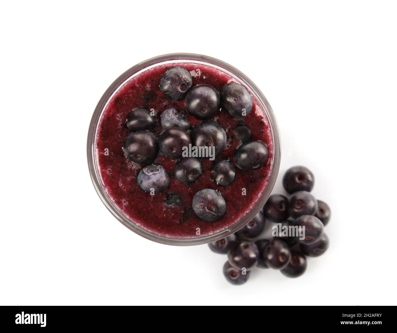 Glass with delicious acai smoothie on white background Stock Photo - Alamy