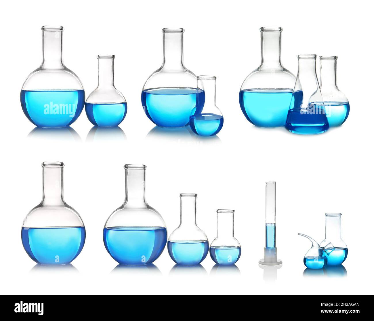 Set with different laboratory glassware and liquid for analysis on ...