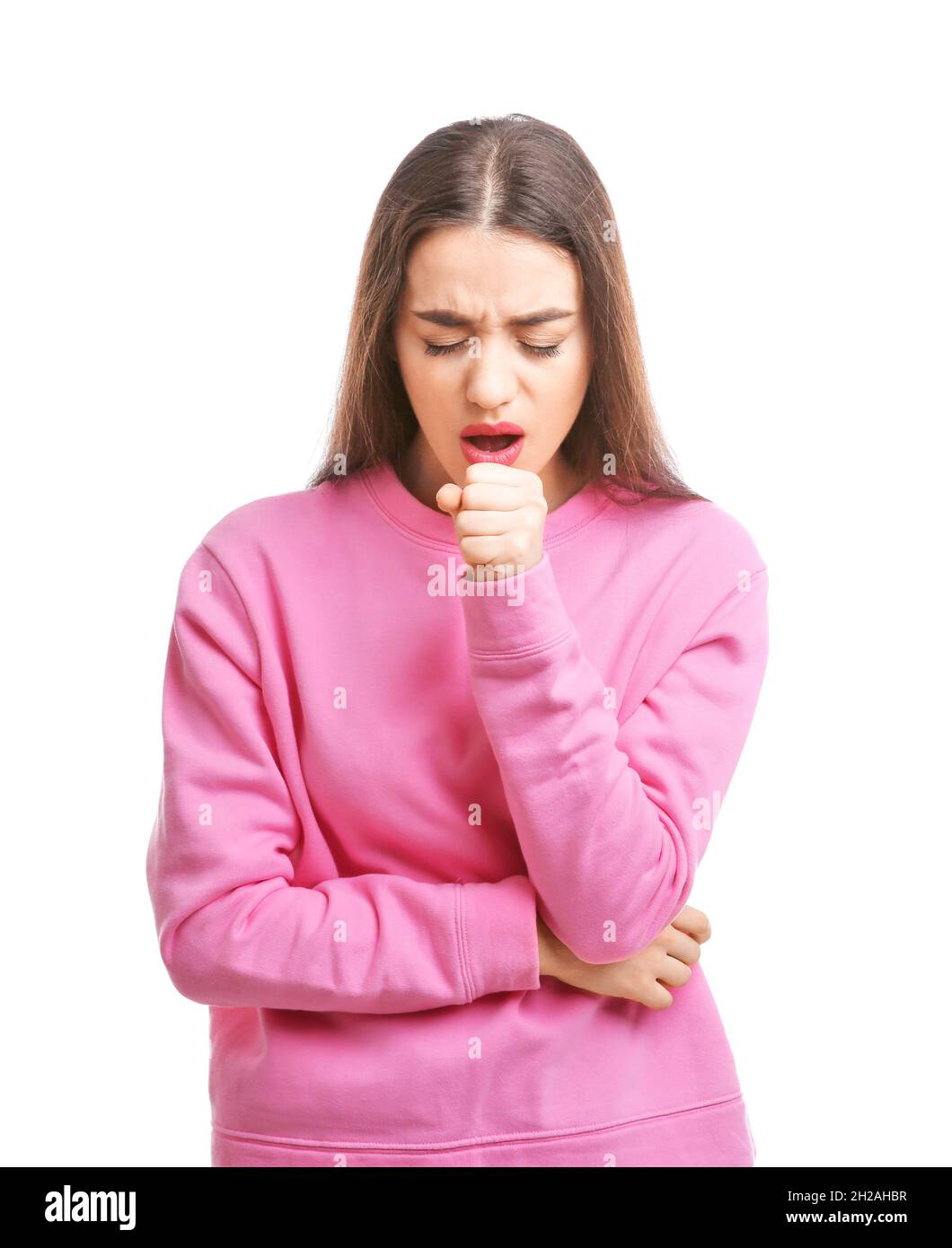 Young woman coughing on white background Stock Photo - Alamy