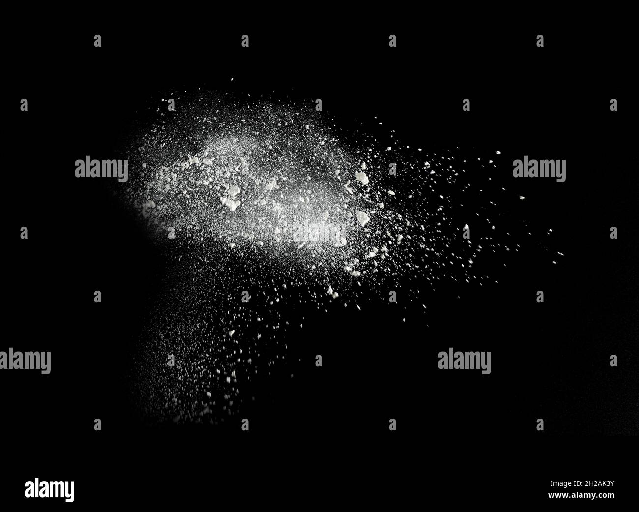 Splash cloud of wheat flour on black background Stock Photo - Alamy