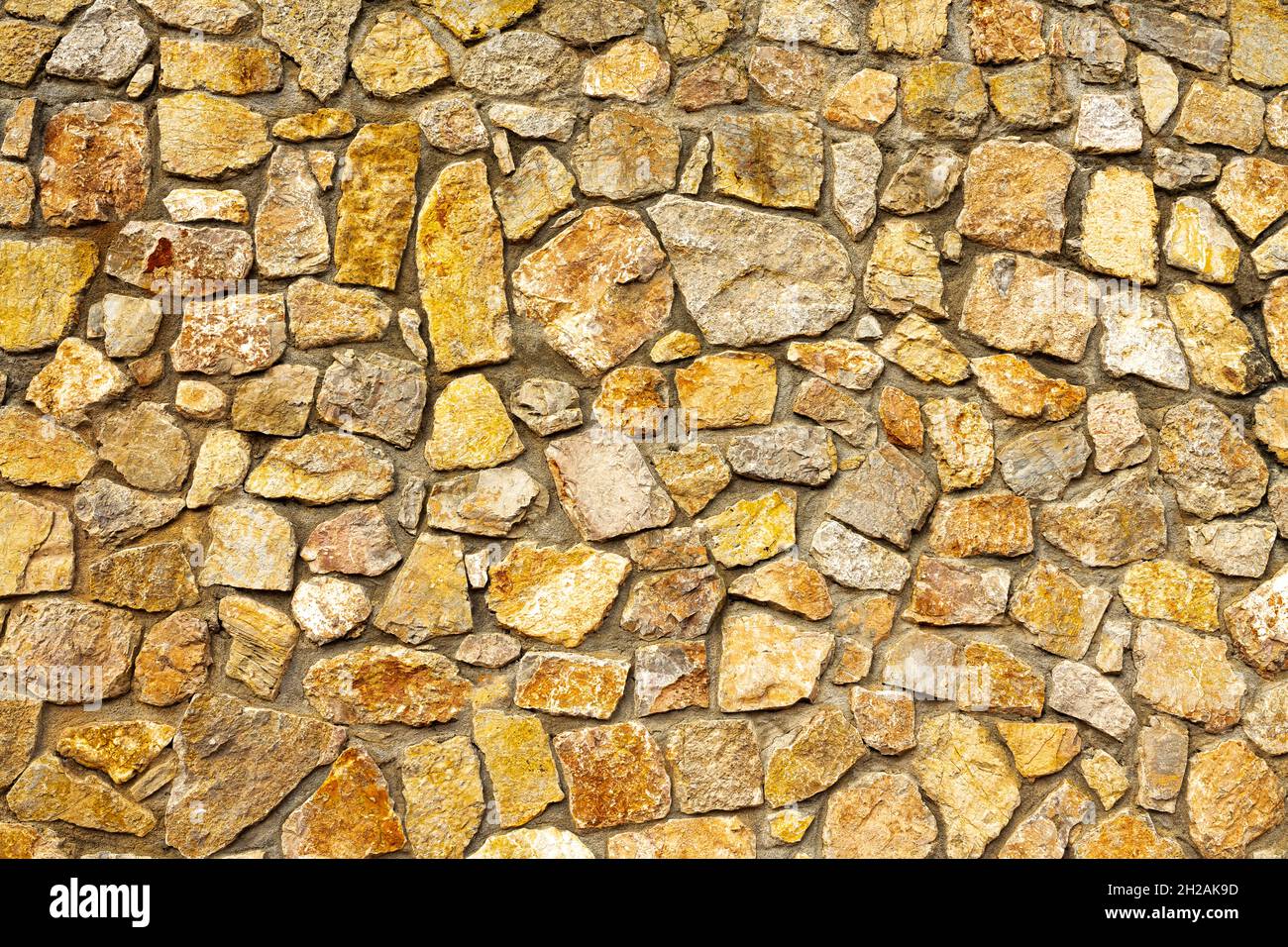 Background of dark yellow orange rough stone wall texture horizo Stock Photo - Alamy