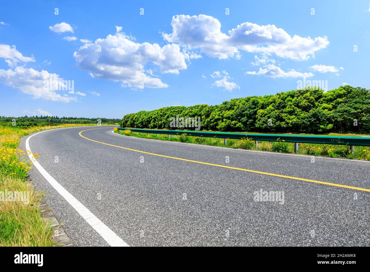 Asphalt road and green forest natural scenery.Highways and natural ...