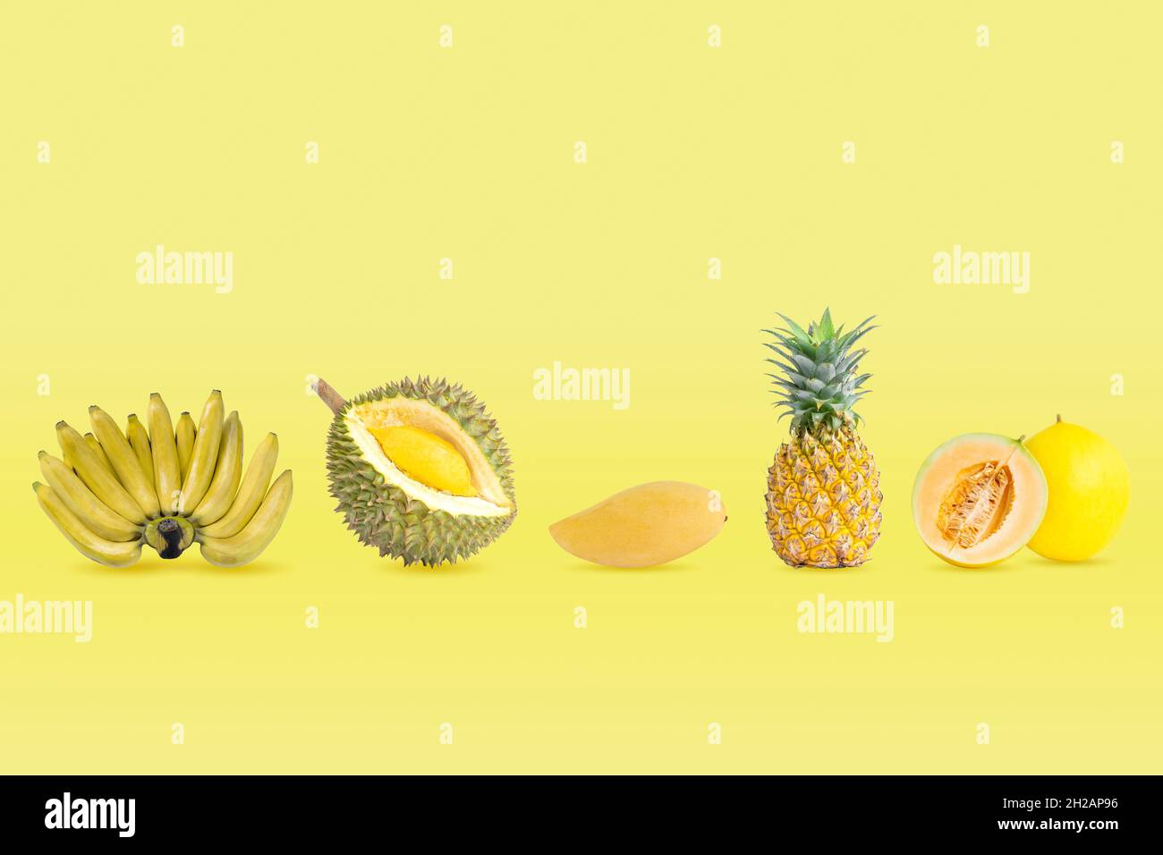 Collection of group of yellow color fruits isolated on yellow pastel ...