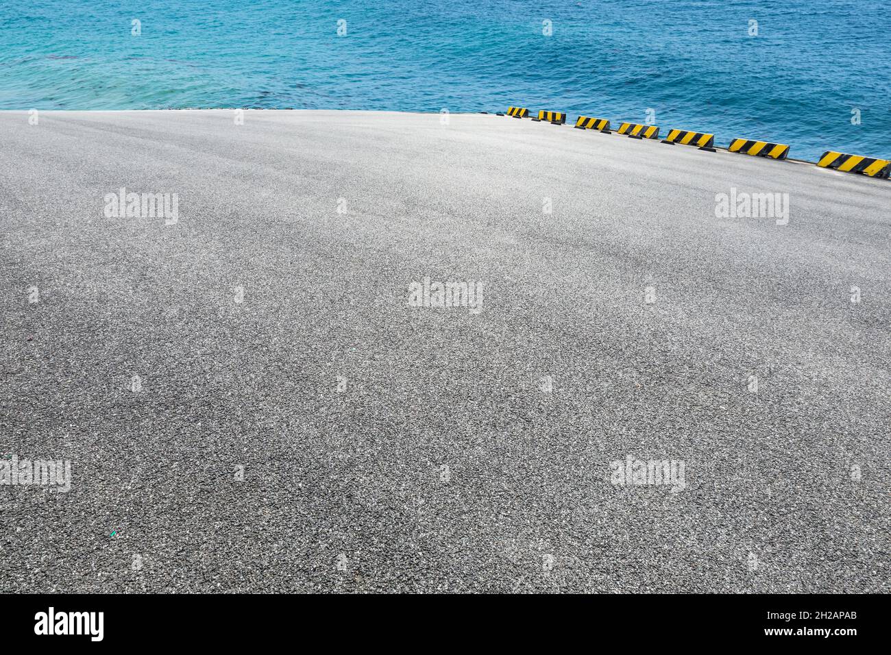 Asphalt road pavement and sea water background.high angle view Stock ...
