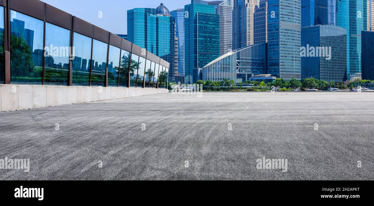 Wide asphalt road pavement and modern urban architecture in Shanghai ...
