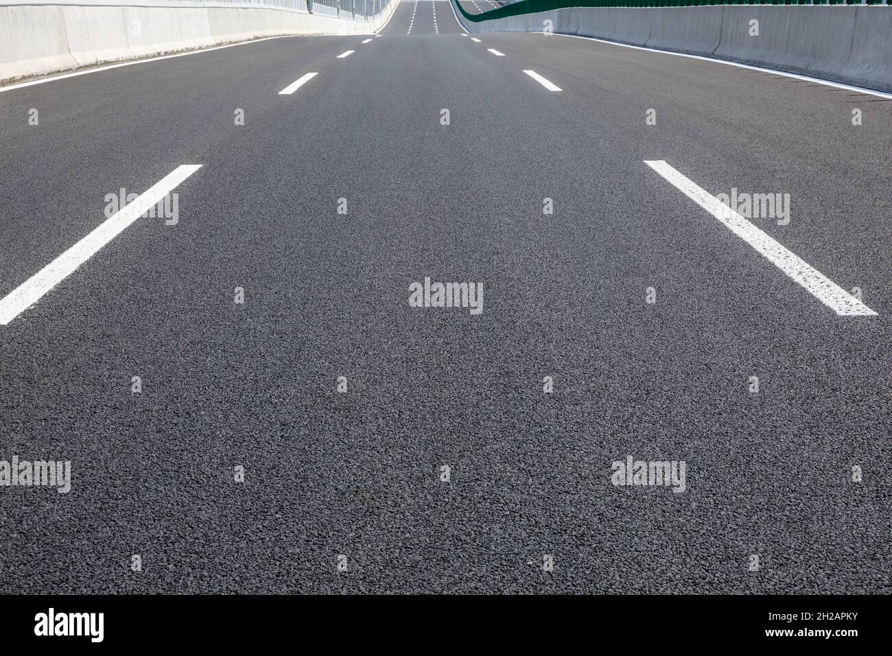 Straight asphalt road pavement scene Stock Photo - Alamy