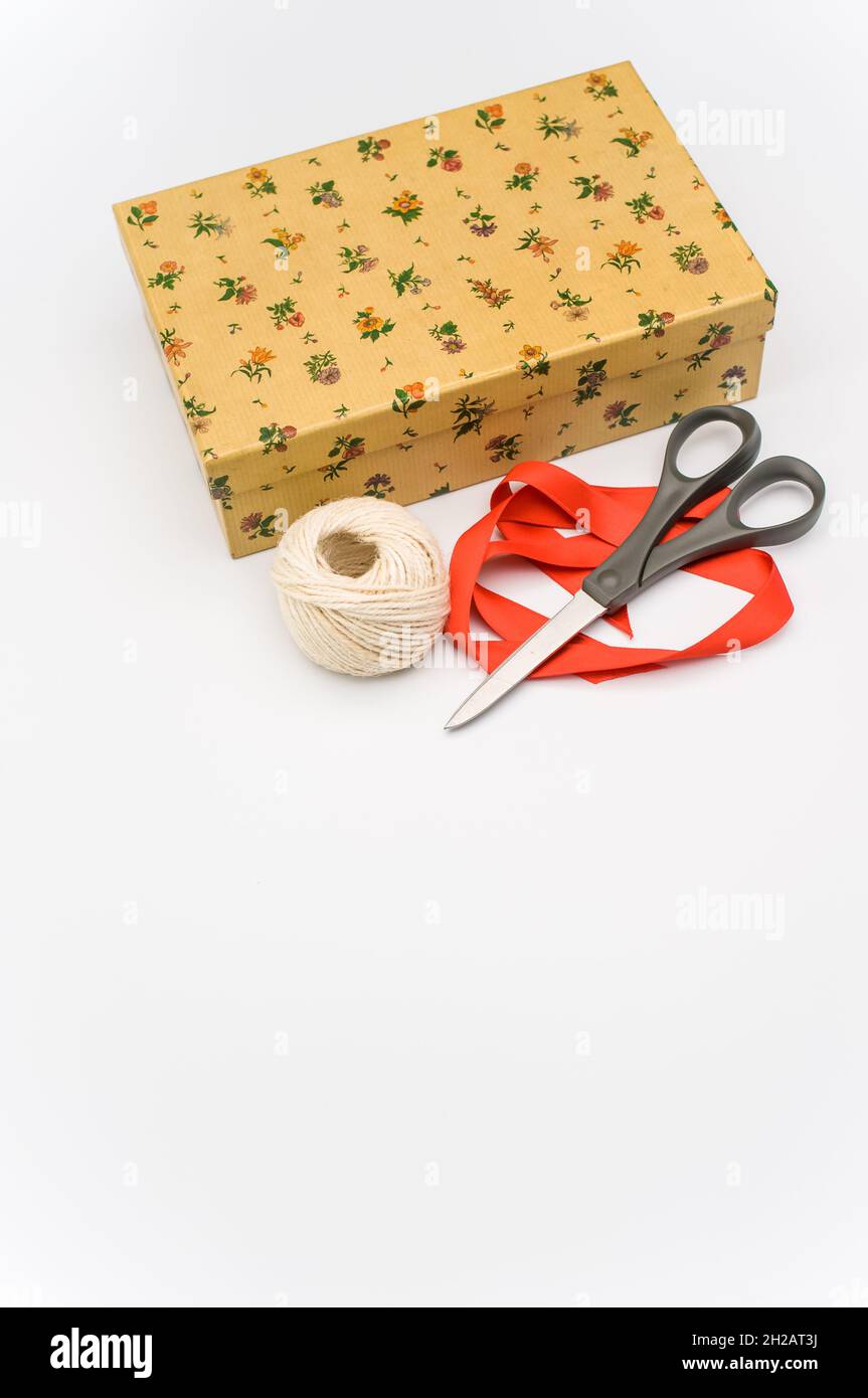 decorated paperboard box with lid decorative yarn and scissors on a ...