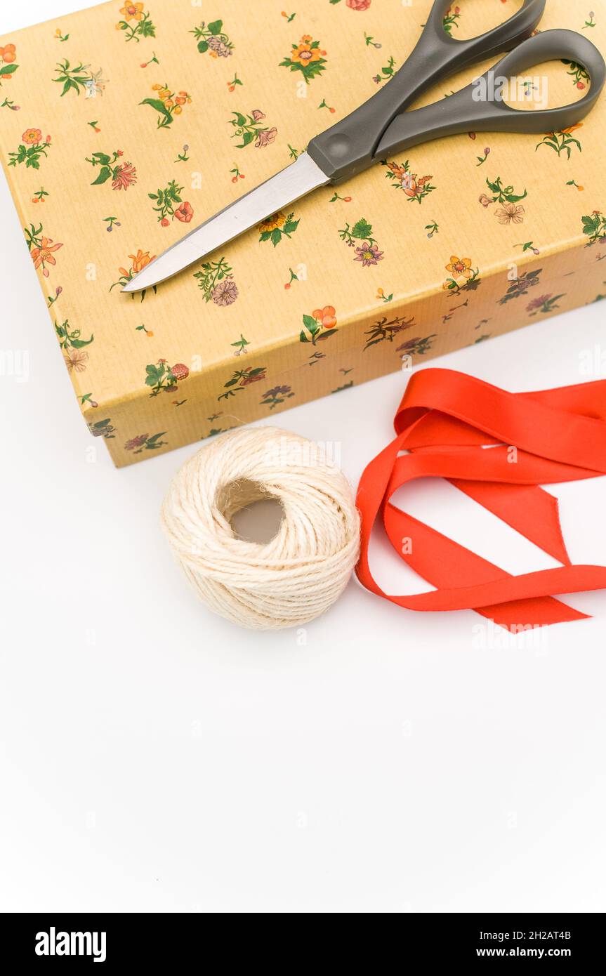 decorated paperboard box with lid decorative yarn and scissors on a ...