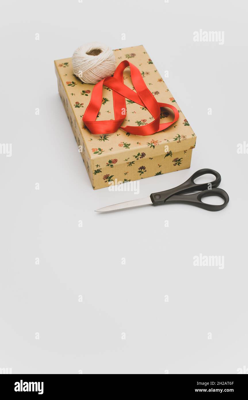 decorated paperboard box with lid decorative yarn and scissors on a ...
