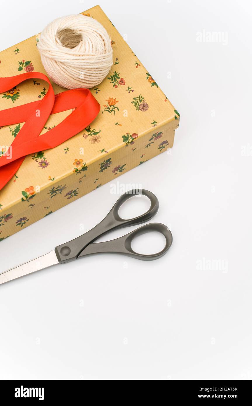 decorated paperboard box with lid decorative yarn and scissors on a ...
