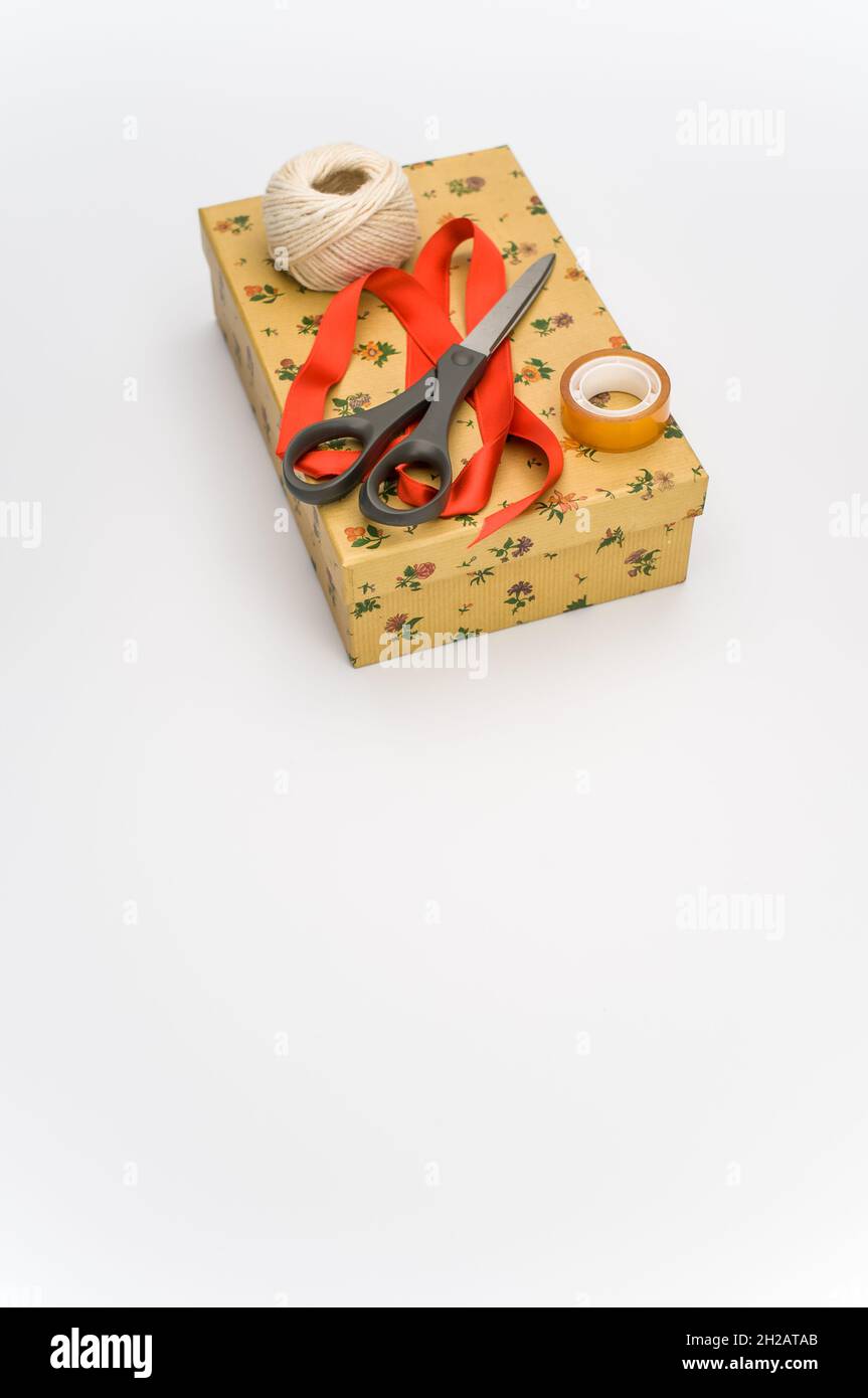 decorated paperboard box with lid decorative yarn and scissors on a ...