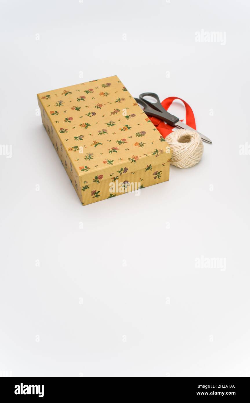 decorated paperboard box with lid decorative yarn and scissors on a ...