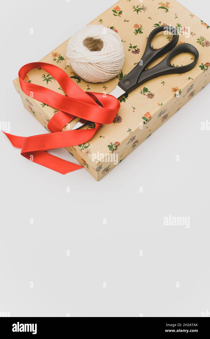 decorated paperboard box with lid decorative yarn and scissors on a ...