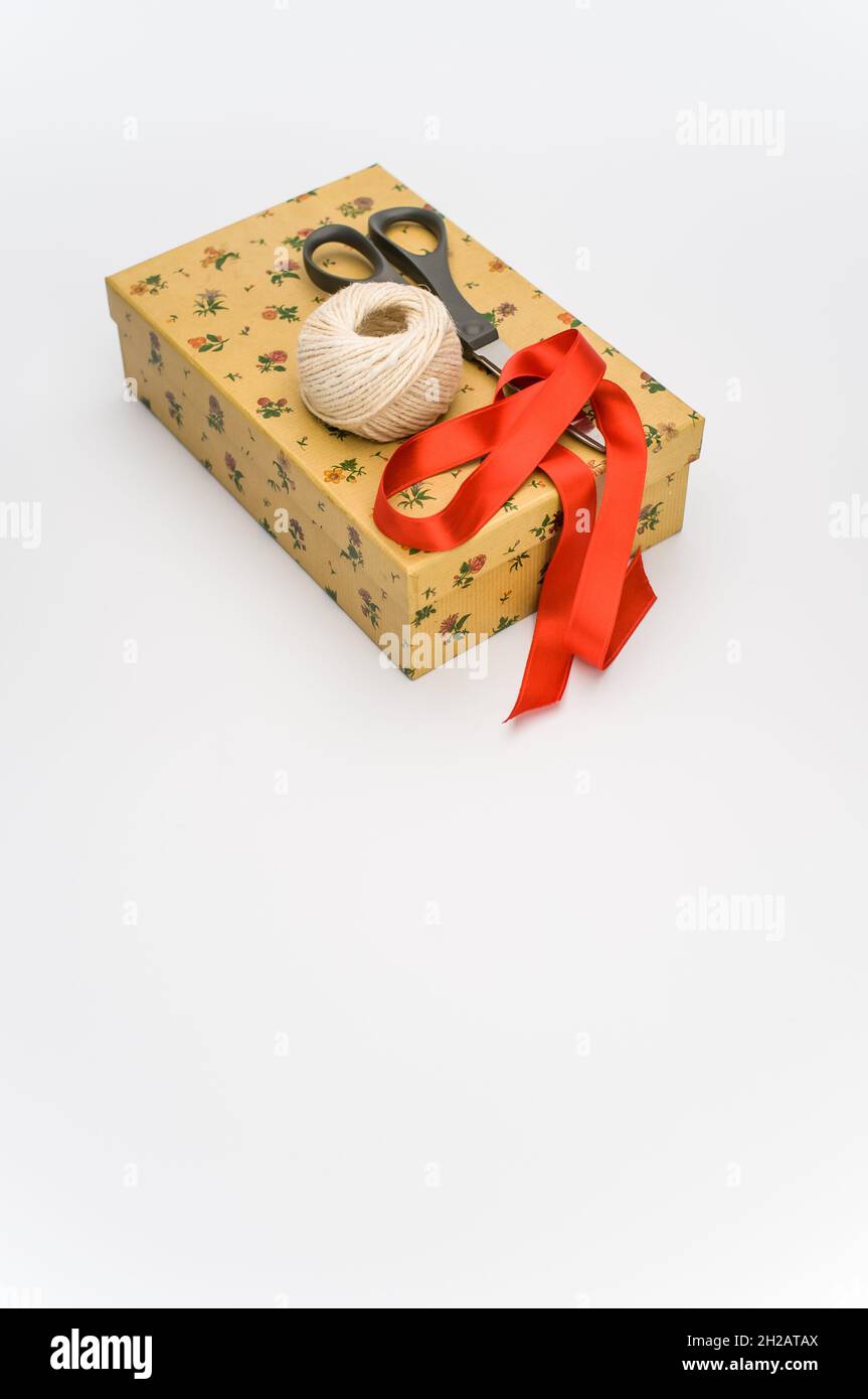 decorated paperboard box with lid decorative yarn and scissors on a ...