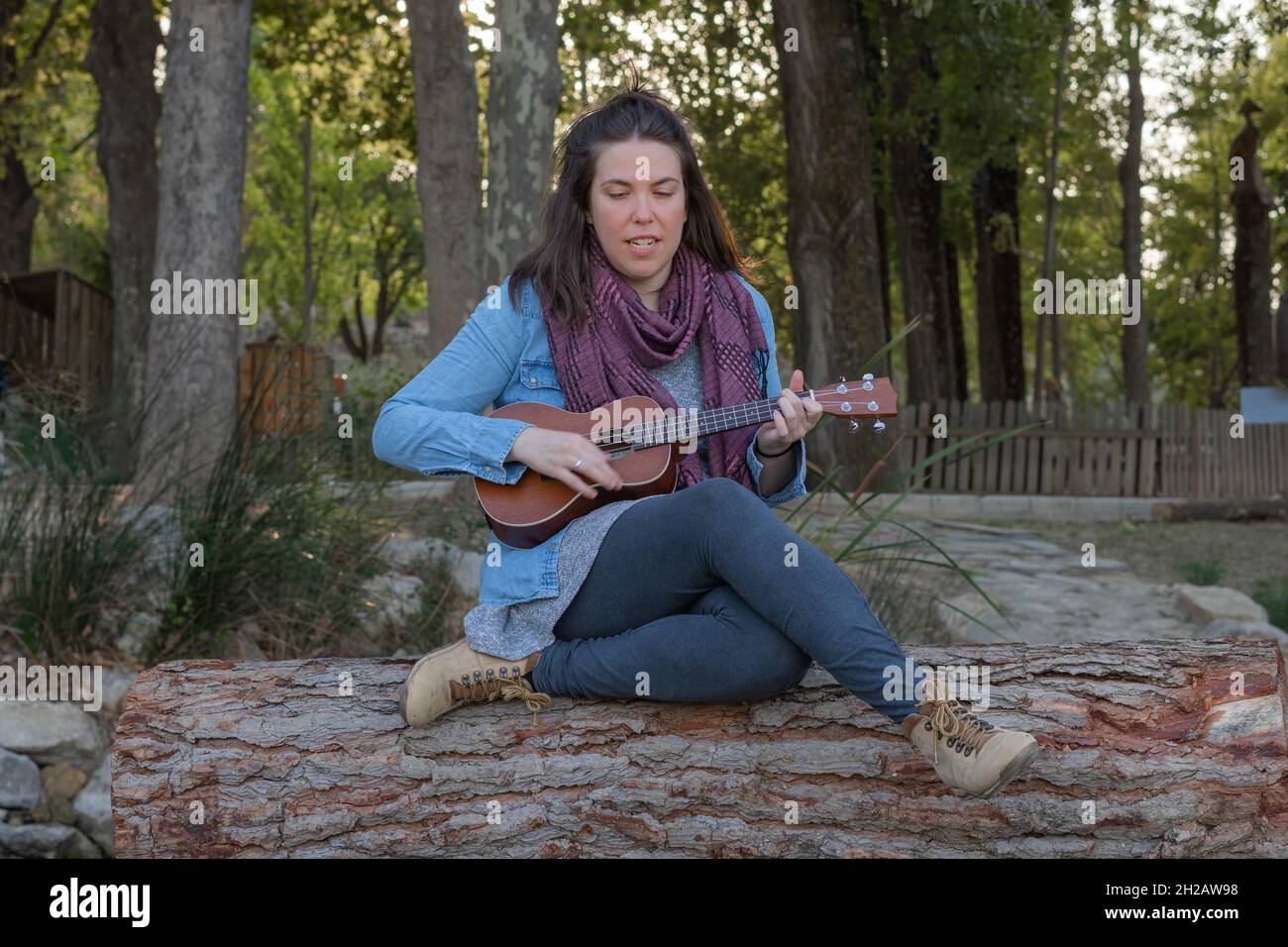 girl playing the ukulele Stock Photo - Alamy