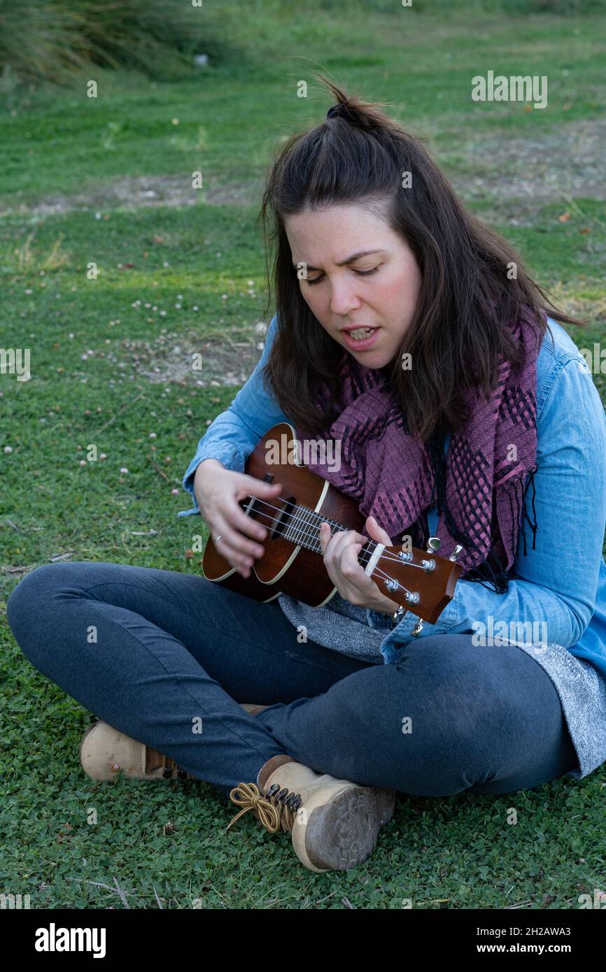 girl playing the ukulele Stock Photo - Alamy