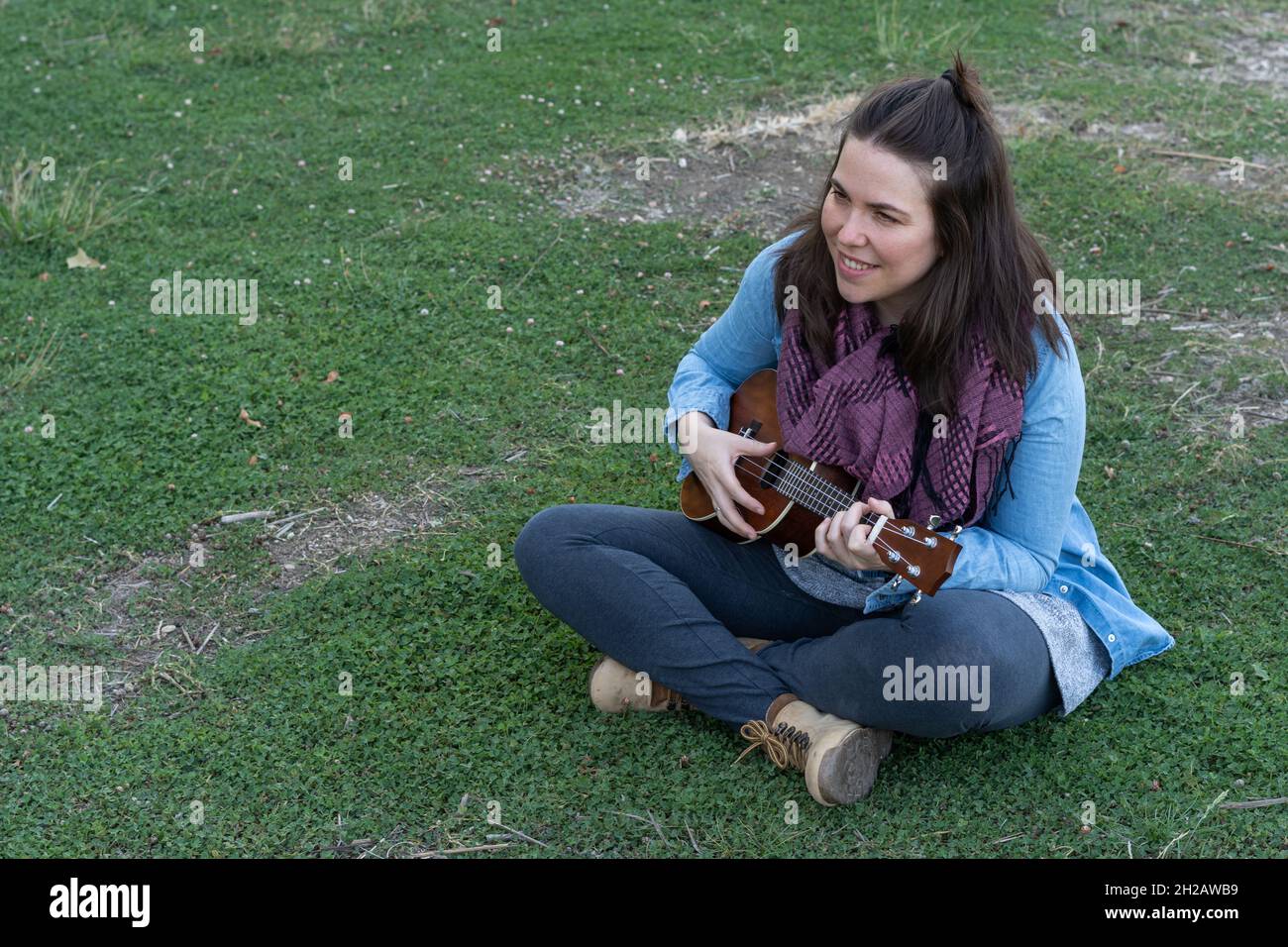 girl playing the ukulele Stock Photo - Alamy