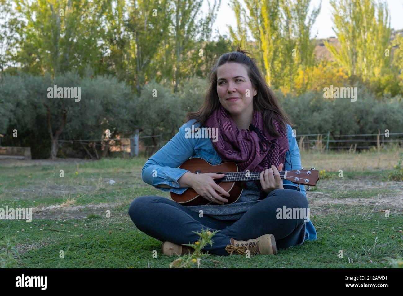 girl playing the ukulele Stock Photo - Alamy