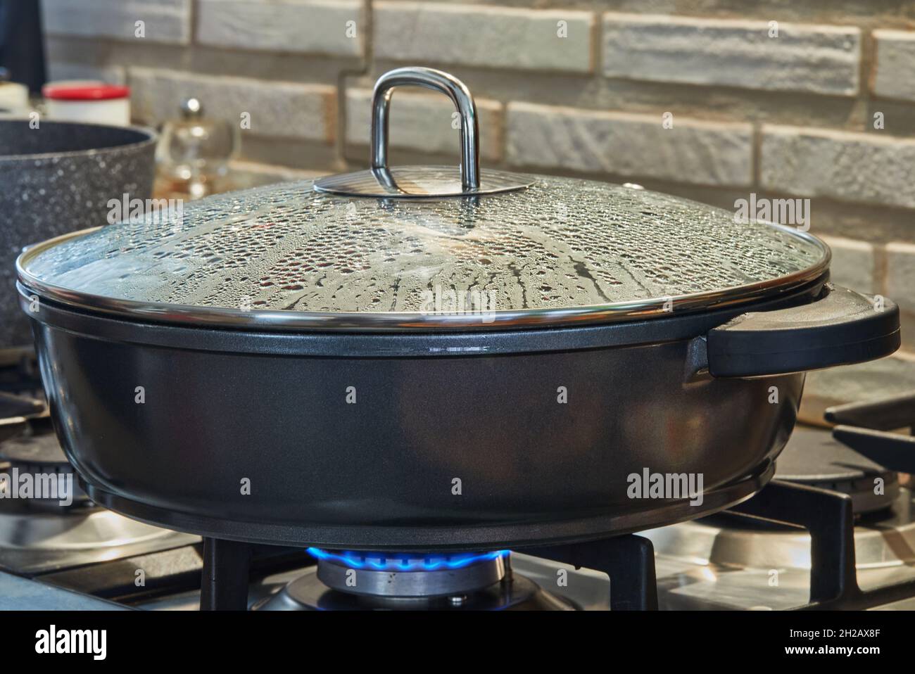 Cooking in metal pan according to recipe from the Internet Stock Photo ...