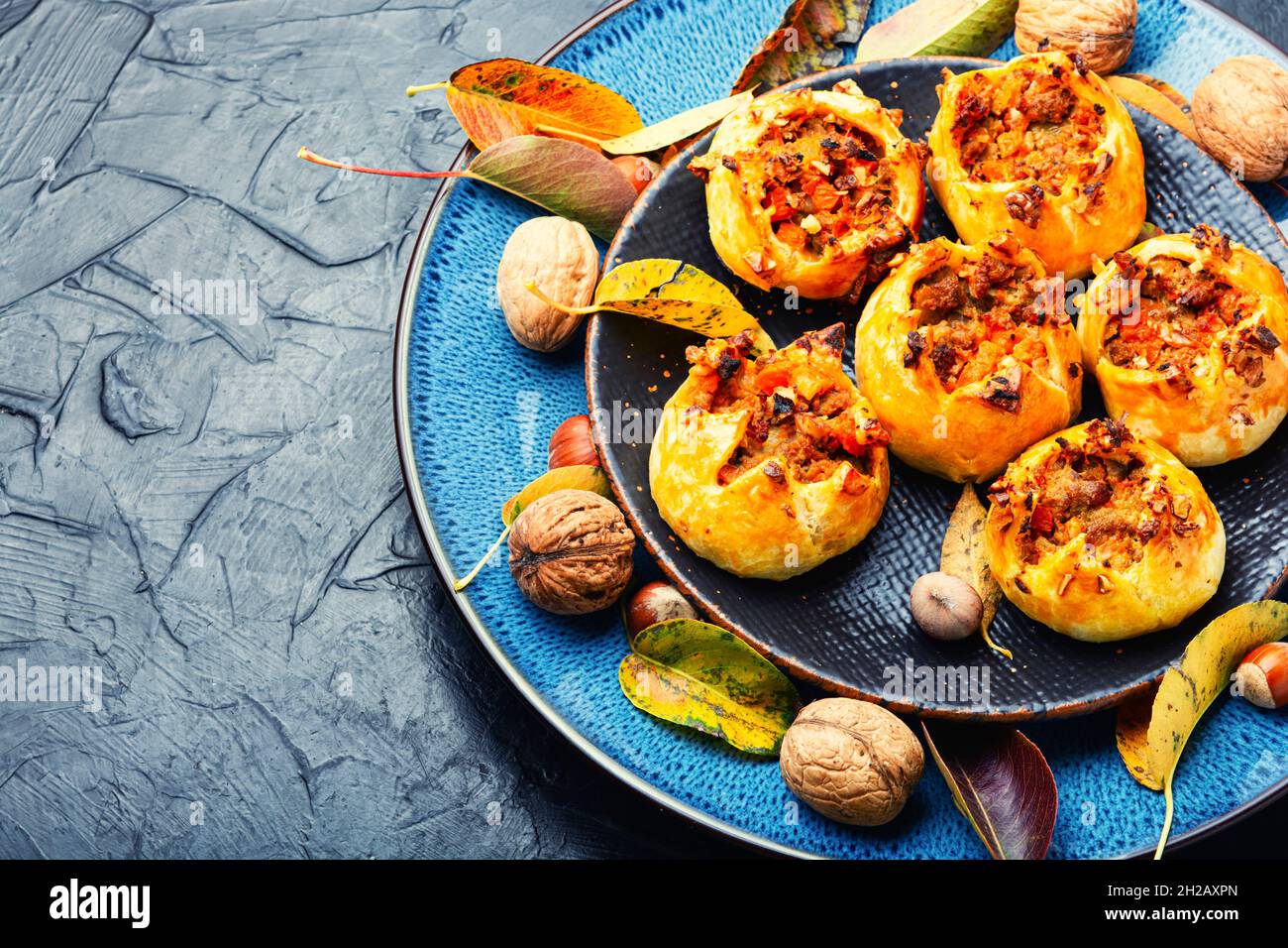 Autumn homemade pastries.Seasonal buns with minced meat and pumpkin ...