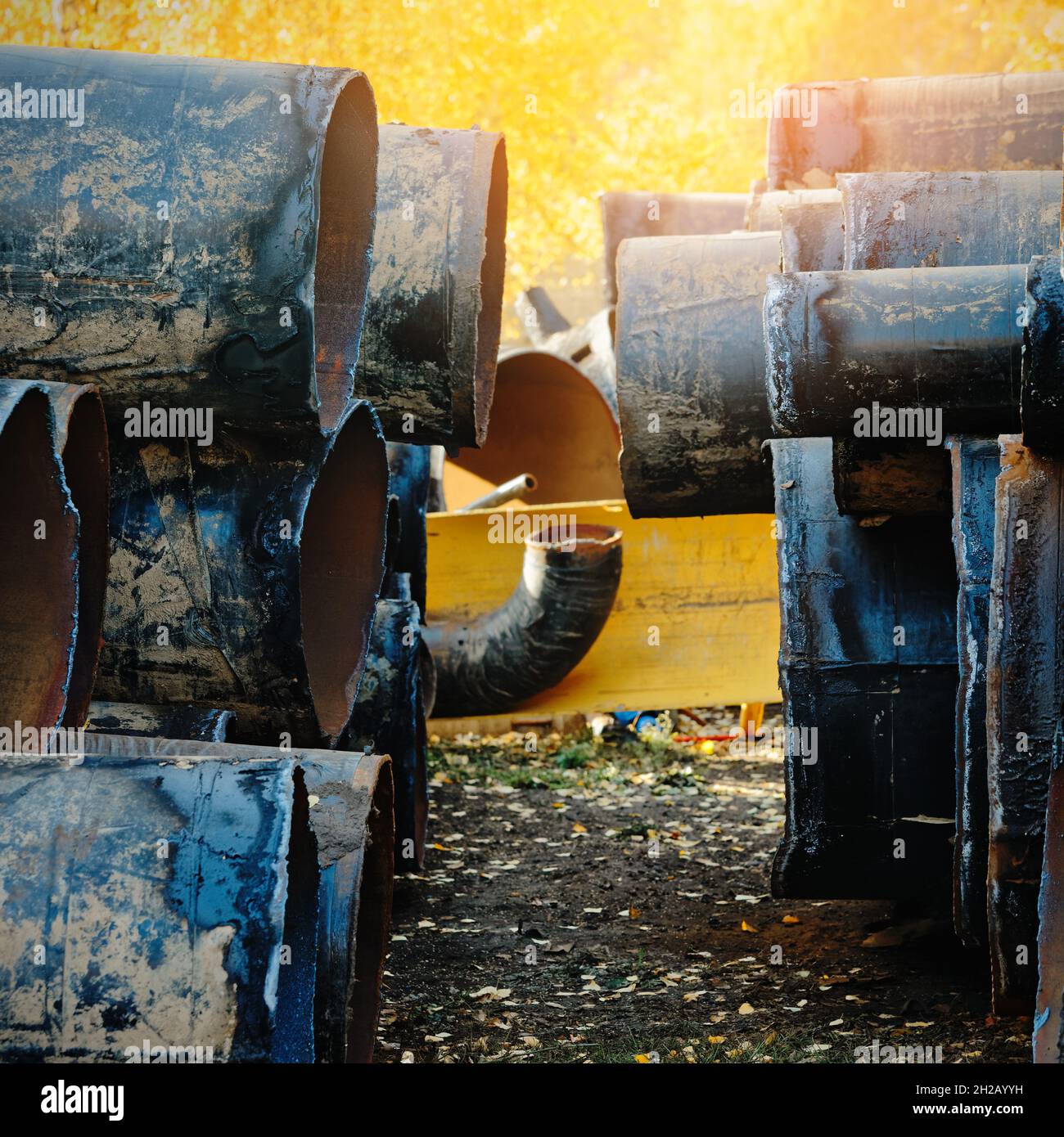 Scrap metal dump. Old used gasification pipes are cut into pieces and ...