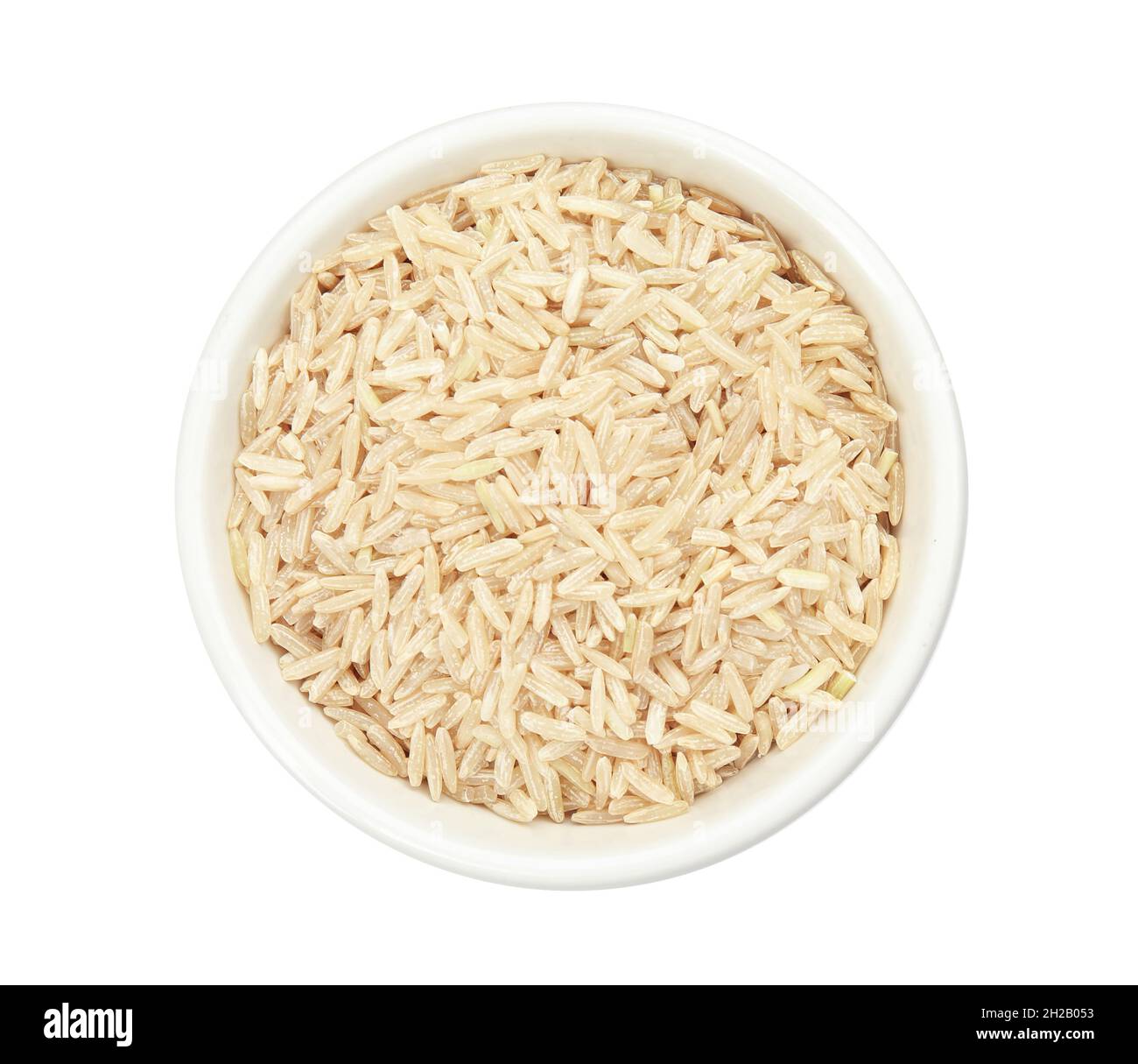 Bowl with raw unpolished rice on white background, top view Stock Photo ...