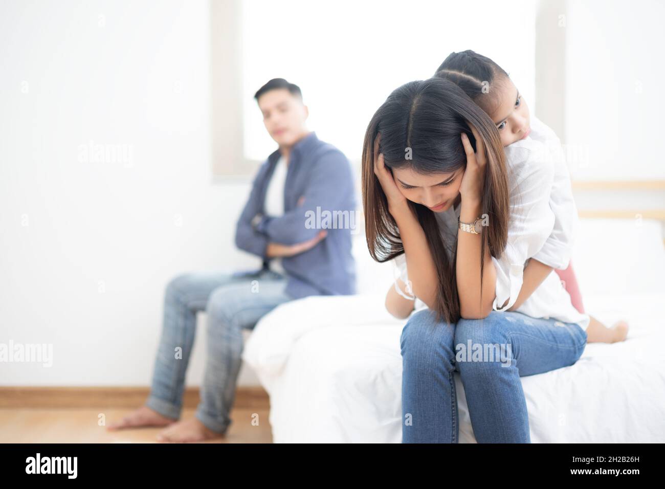 Parents arguing in front of their daughter. Family quarrel concept ...