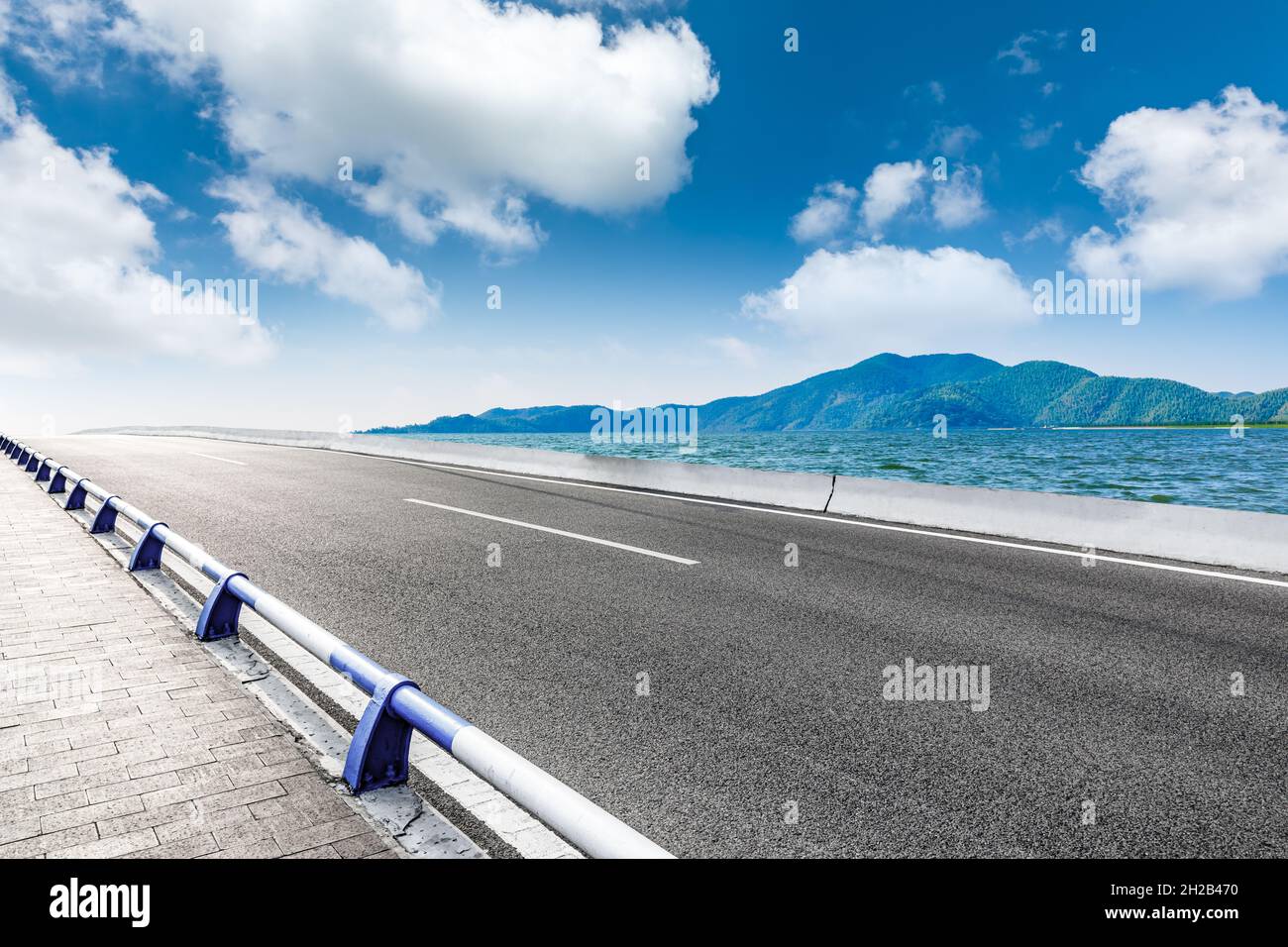 New asphalt road and mountain with river natural landscape in the ...
