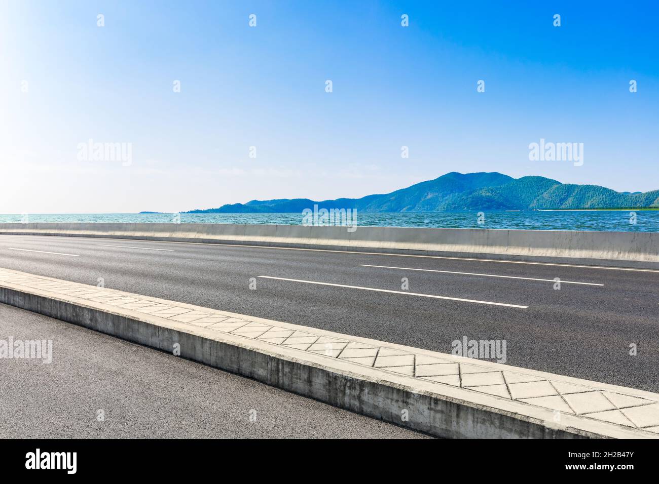New asphalt road and mountain with river natural landscape in the ...