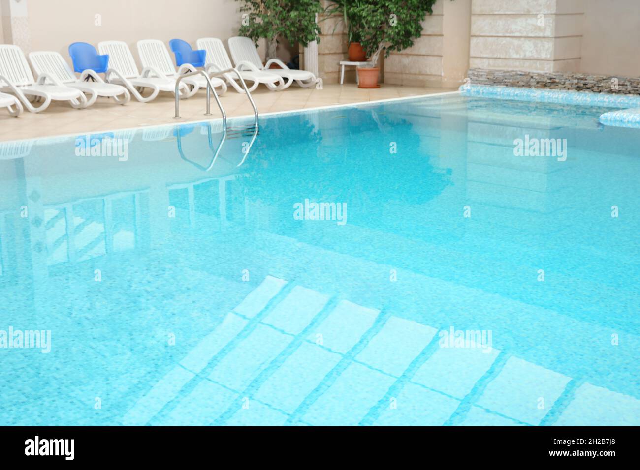 Swimming pool with refreshing blue water. Time to relax Stock Photo - Alamy
