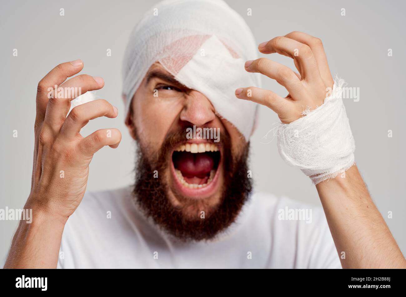 patient with a bandaged head and an eye blood isolated background Stock ...