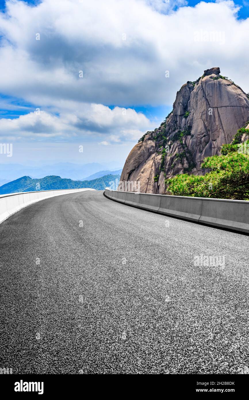 Asphalt road and mountain natural landscape Stock Photo - Alamy