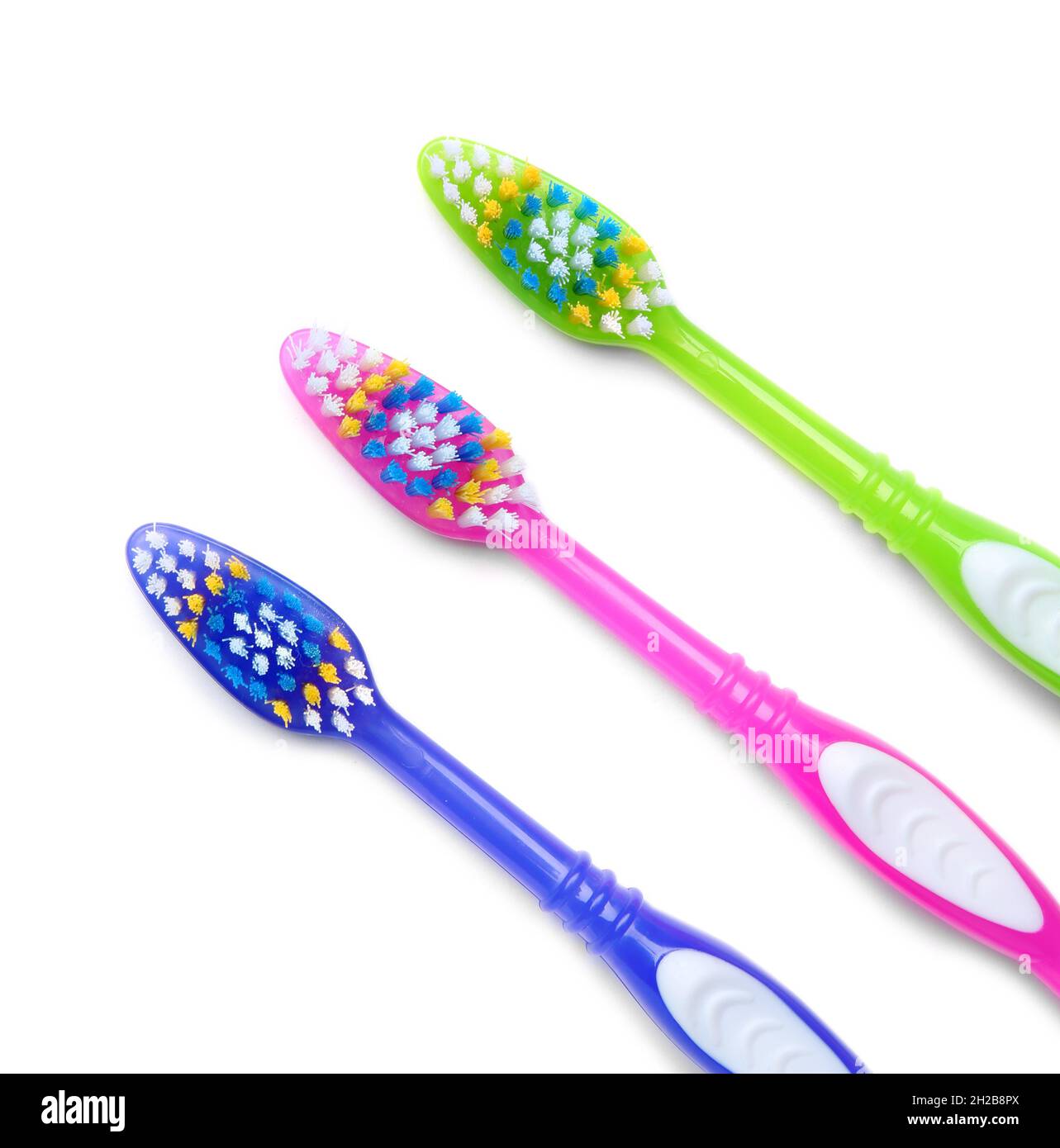 Color toothbrushes on white background. Dental care Stock Photo - Alamy