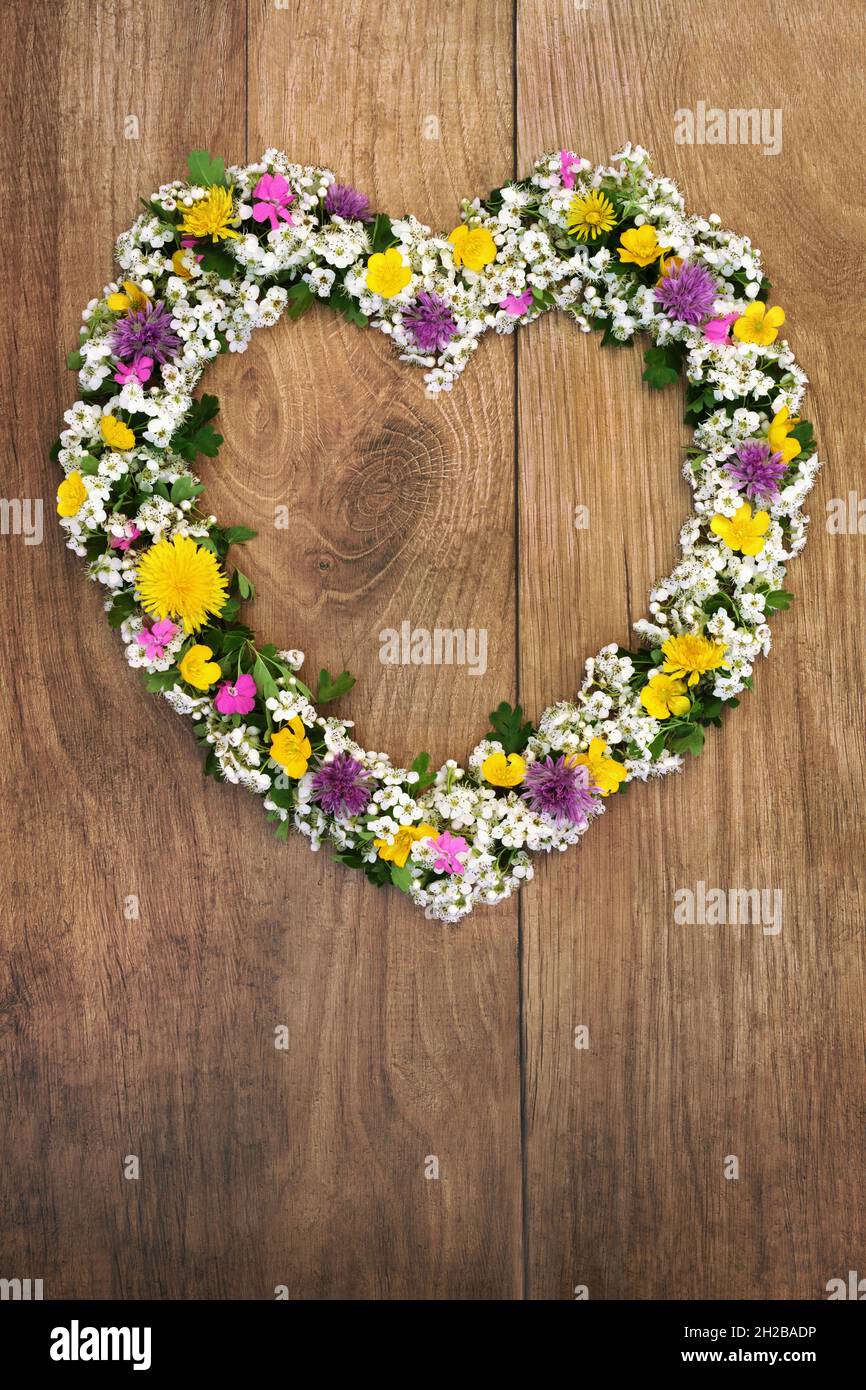 Beautiful heart shaped spring flower wreath. Flowers and leaves used in ...