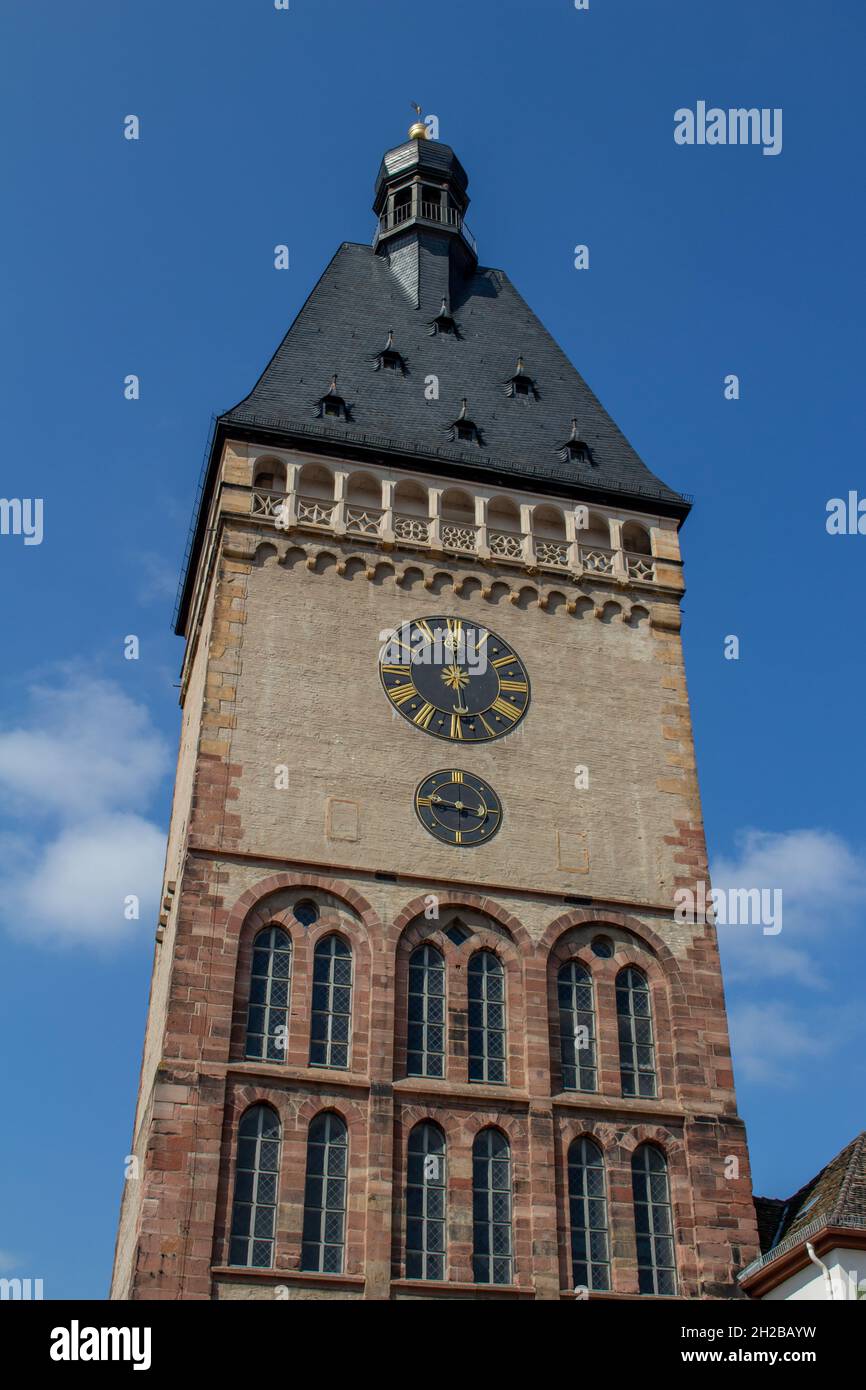 Close, upward view of a European medieval clock tower gate with blue ...