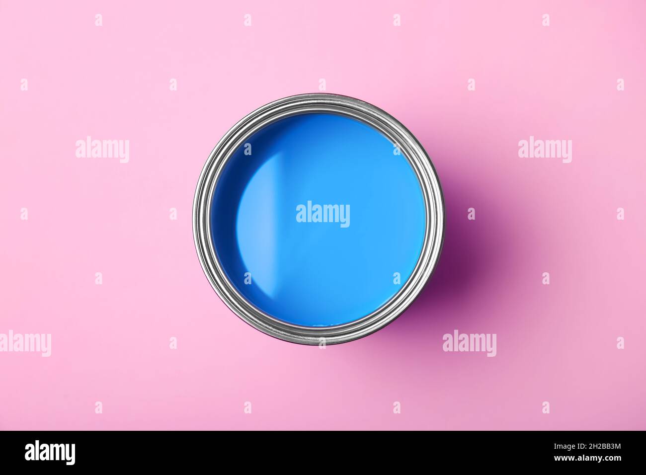 Can with blue paint on pink background, top view Stock Photo - Alamy