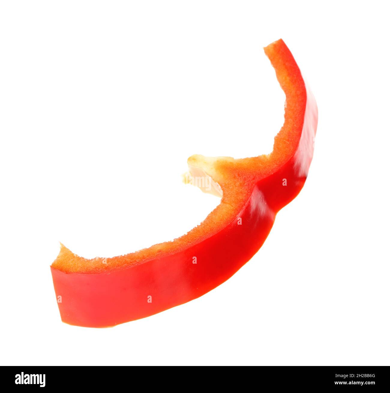 Slice of ripe bell pepper on white background Stock Photo - Alamy