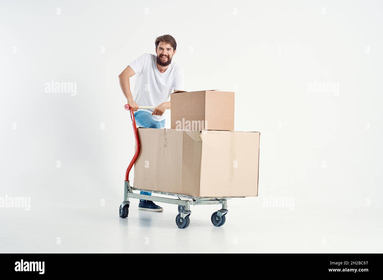 Man shipping transport in a box isolated background Stock Photo - Alamy