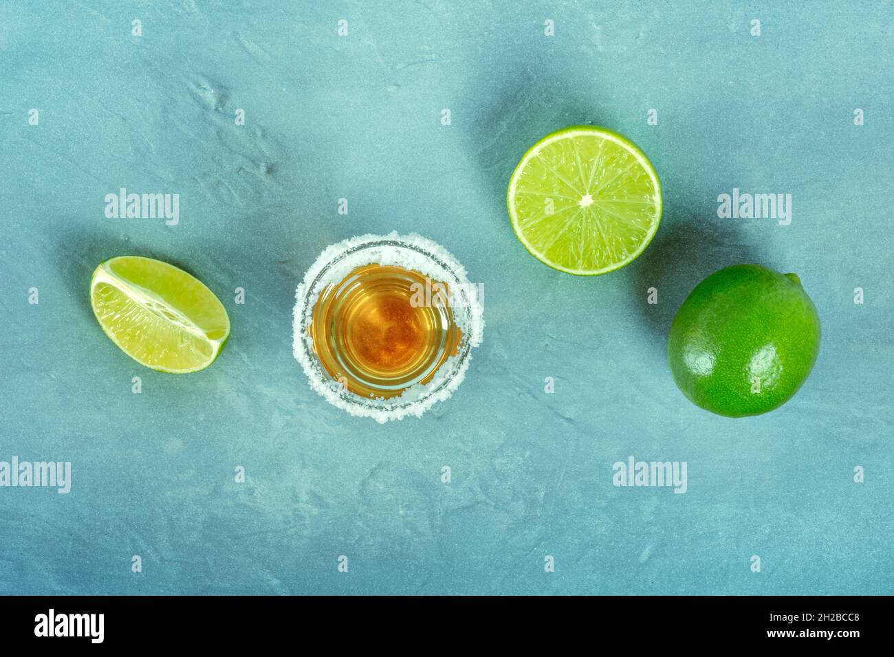 Tequila gold shot with limes, Mexican liquor with a salted rim, shot ...
