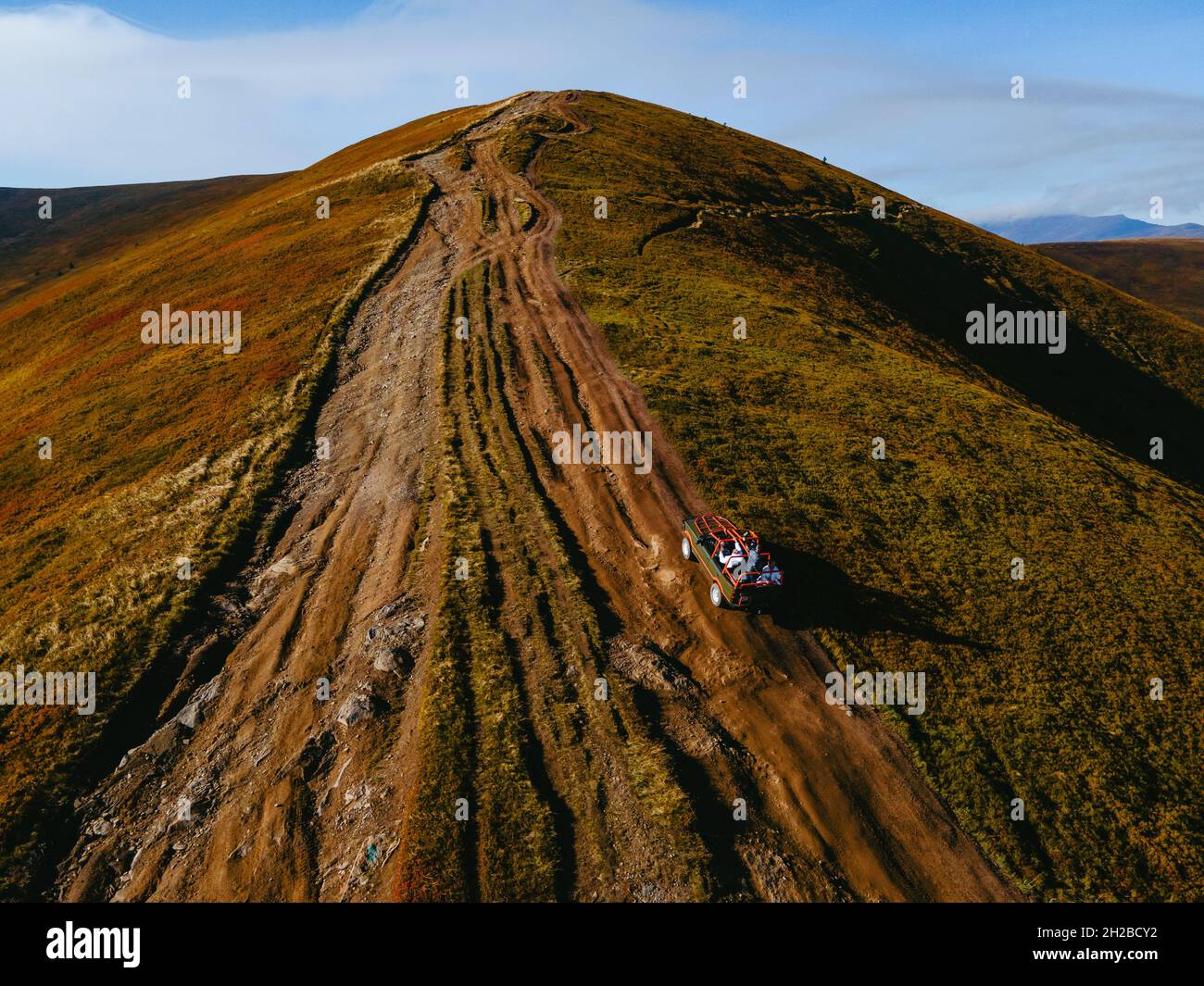 aerial view of suv off road travel climbing up by mountain hill copy ...