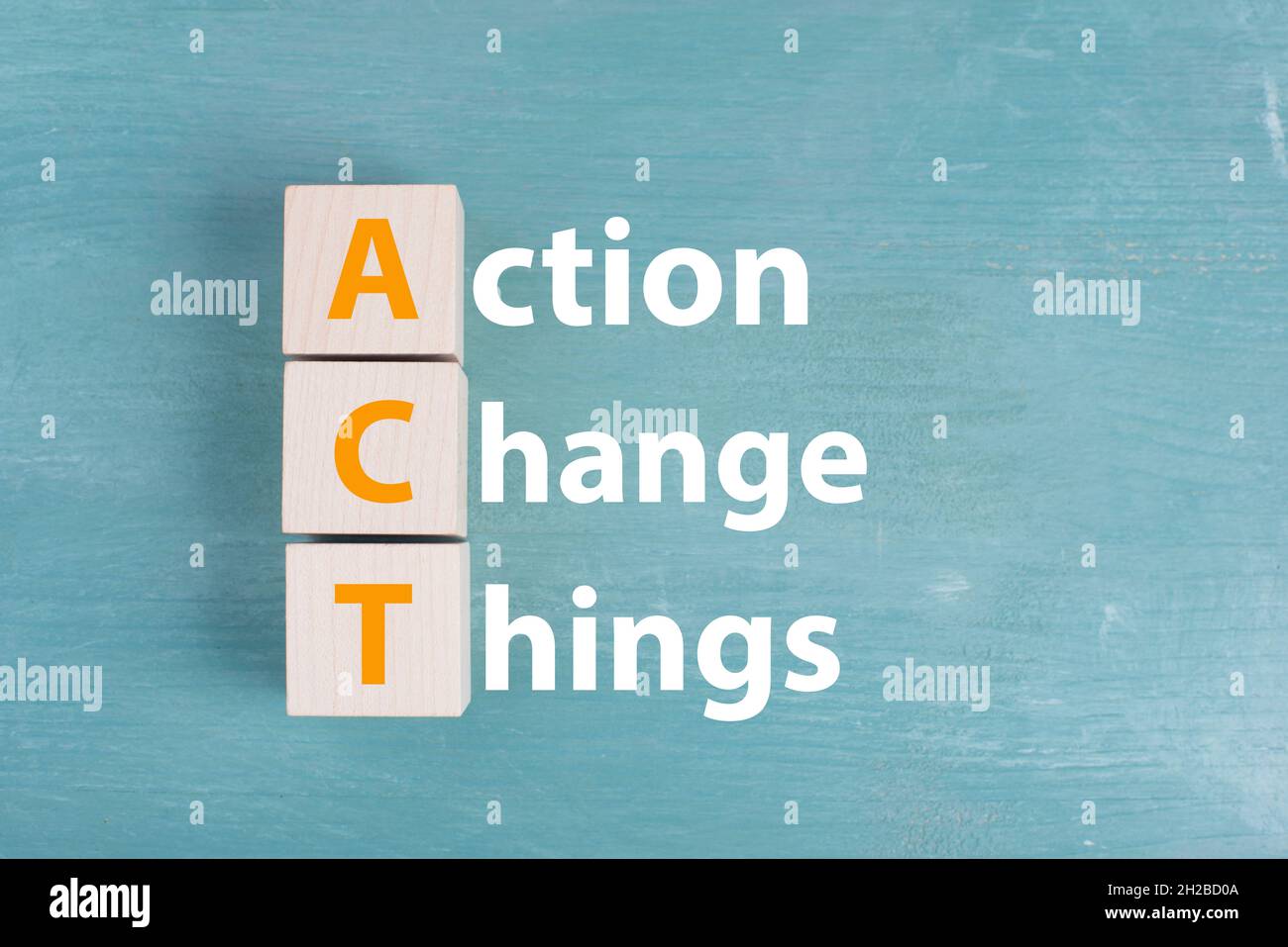 The words action, change, things are standing on a blue colored ...