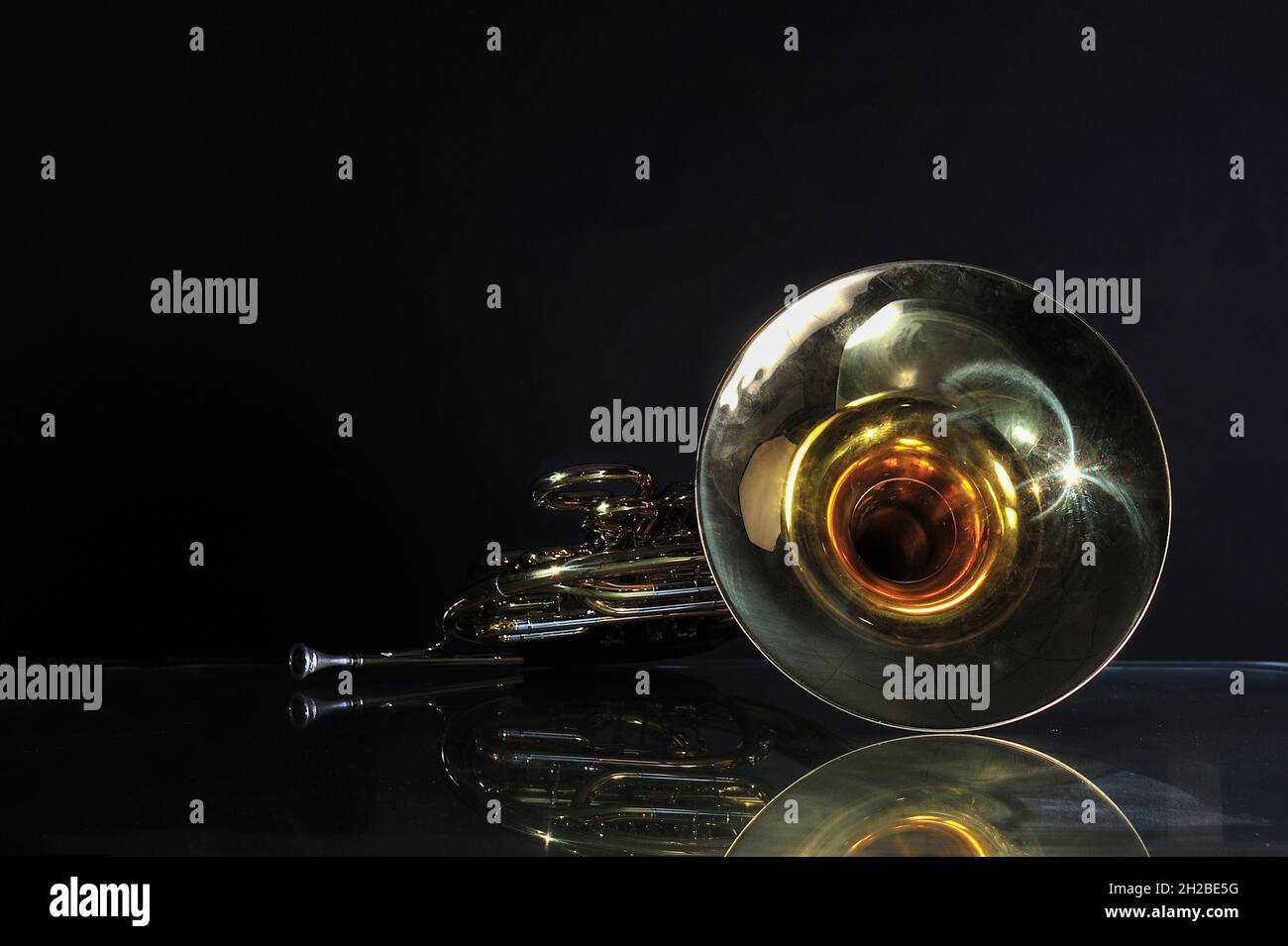 Golden french horn with soft light isolated on black background Stock ...