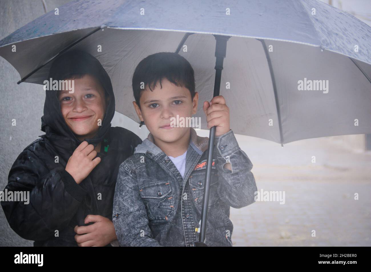 A portrait of a sweet refugee child in the camp. Syrian refugees Stock ...